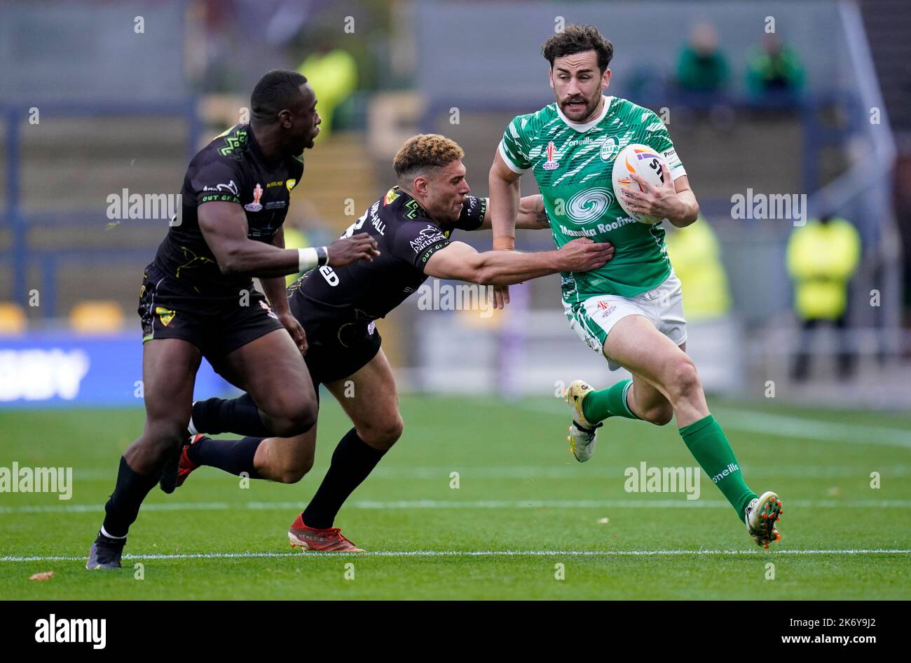 Ireland's Toby King (right) is tackled by Jamaica's James Woodburn-Hall ...