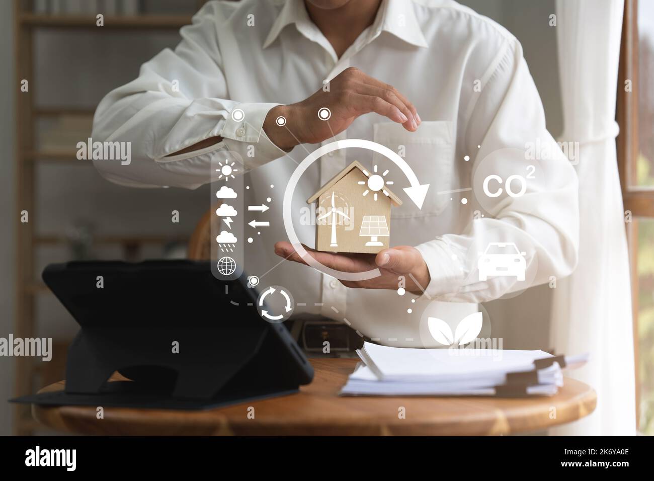 Real Estate Agent showing a energy project for future house. Green ...