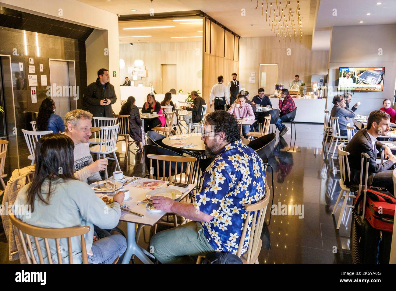 Sitting tables morning overnight guests hi-res stock photography and ...