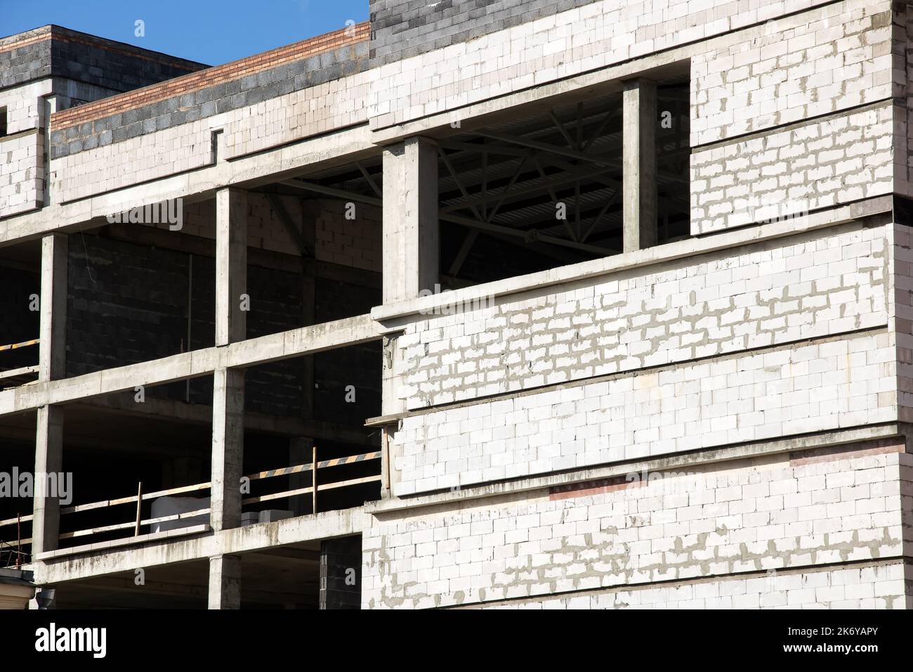 Construction site and construction of a tall building from blocks close ...