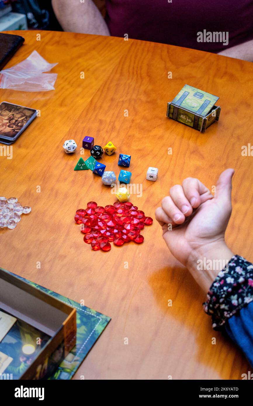 Cheerful friends playing cards hi-res stock photography and images - Alamy