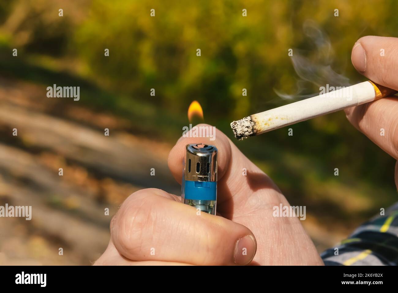 Hand holding lighter cigarette lighter hi-res stock photography and ...