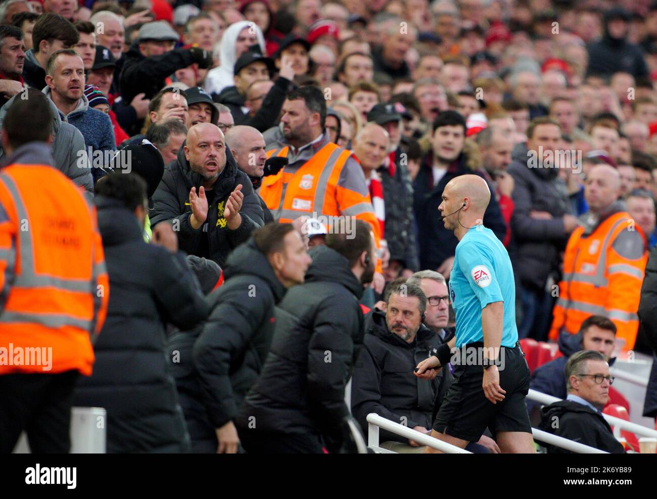 Referee Anthony Taylor goes to check VAR during the Premier League ...