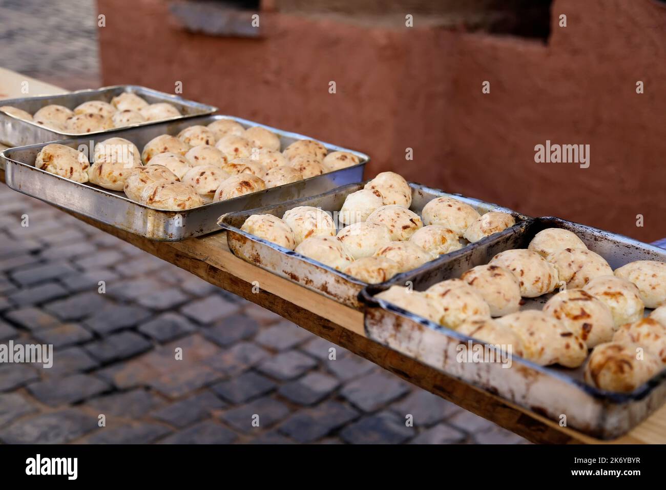 cheese bread and served in tin tray on table - brazilian food ...
