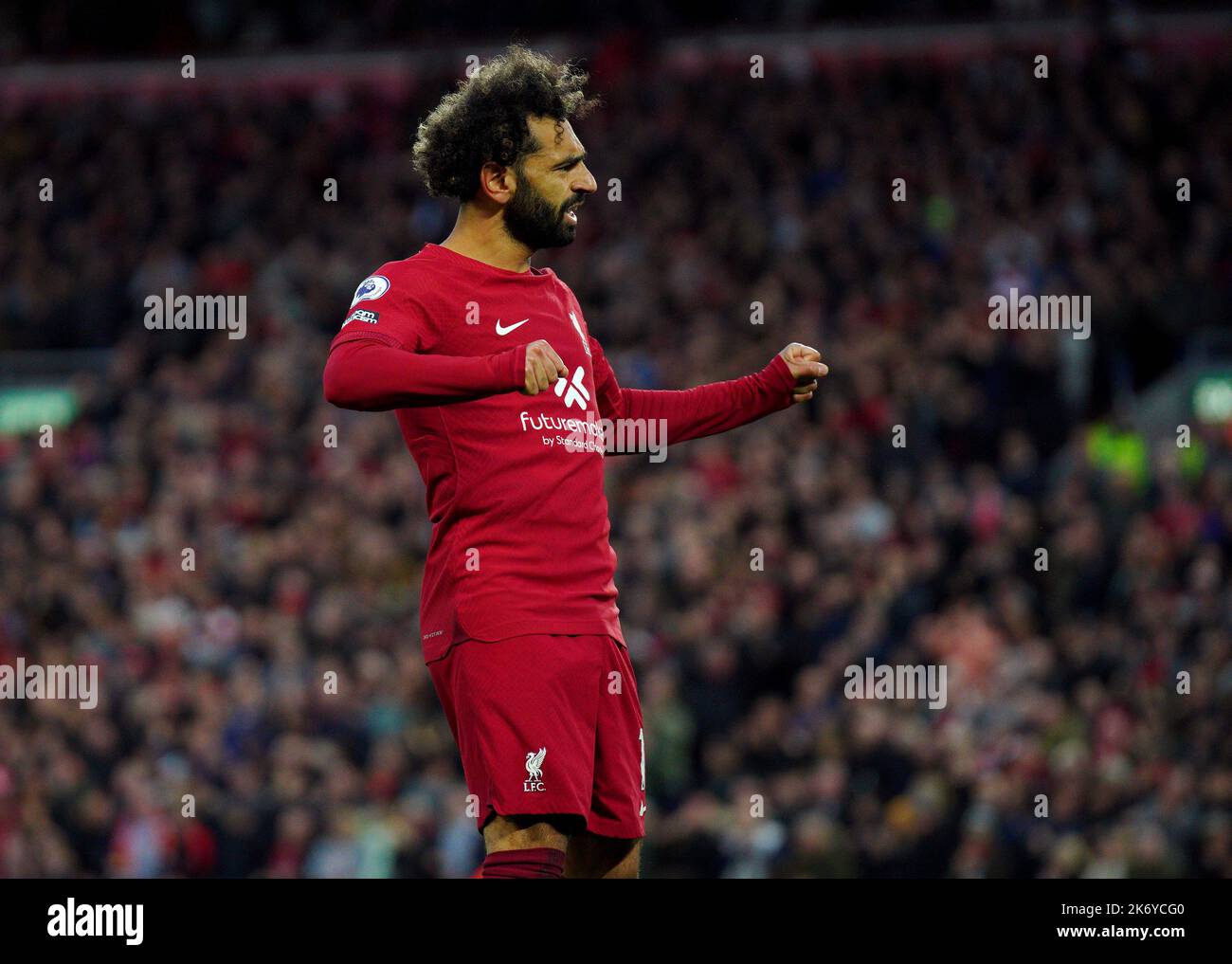 Liverpool's Mohamed Salah celebrates scoring the opening goal during ...