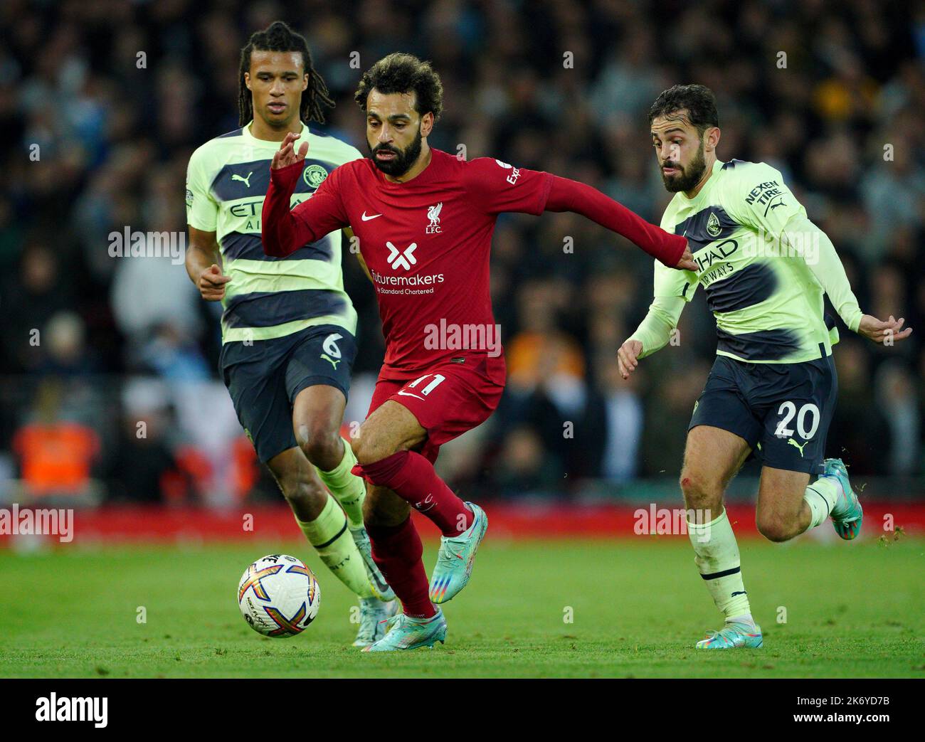 Liverpool's Mohamed Salah gets past Manchester City's Nathan Ake and ...