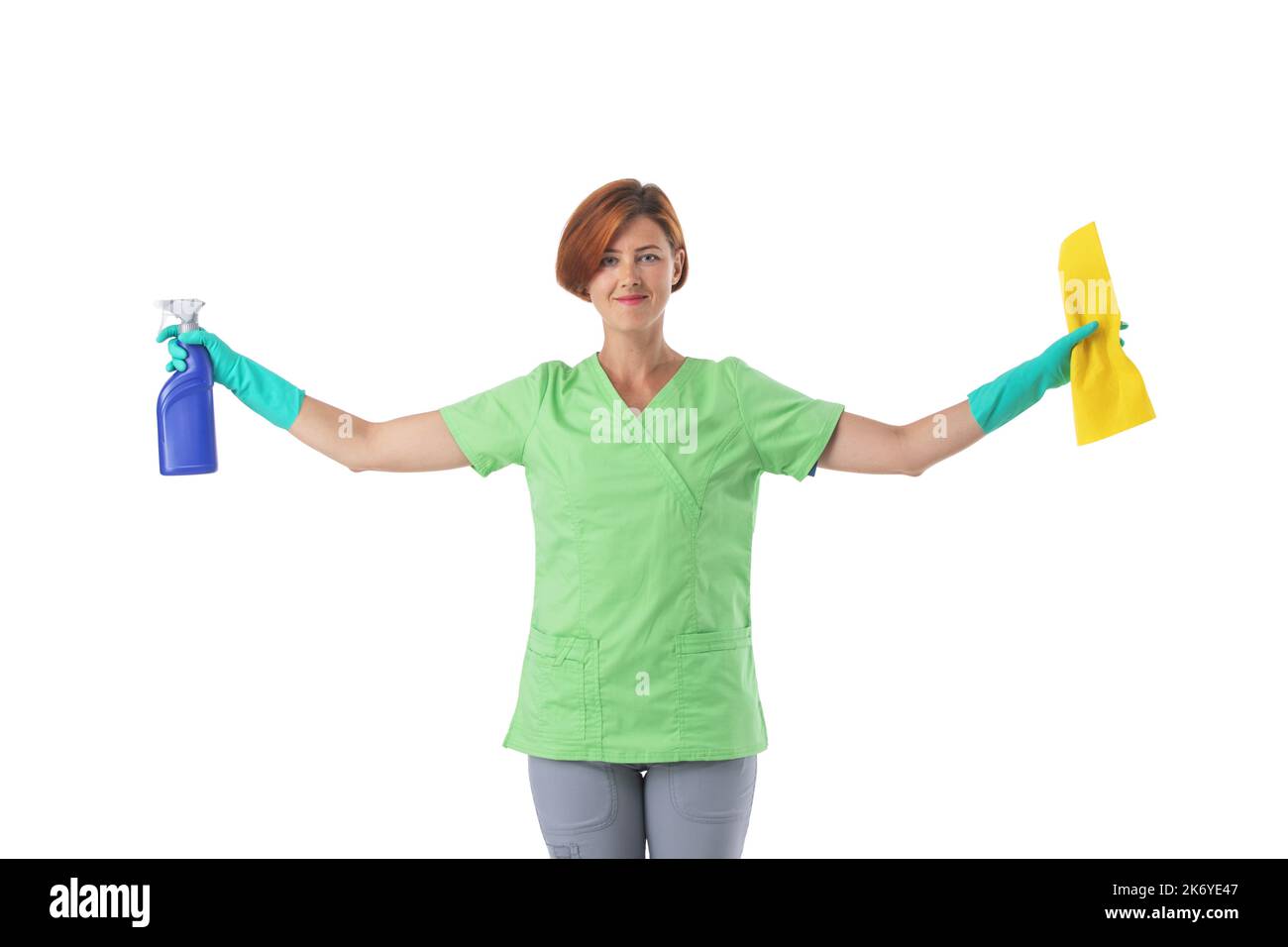 Full length portrait of professional cleaner woman with cleaning spray ...