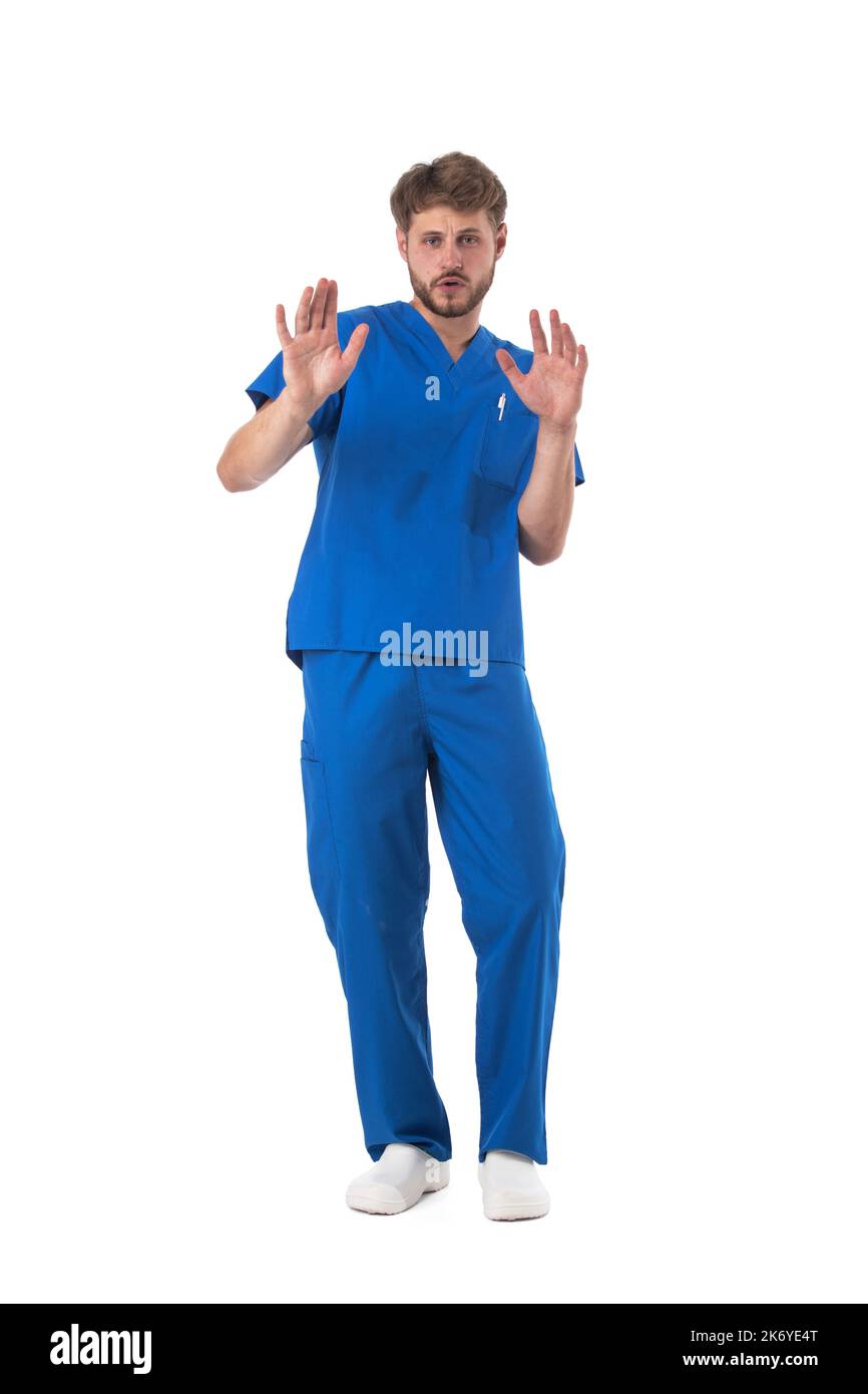 Young male medical nurse healthcare worker showing stop sign isolated ...