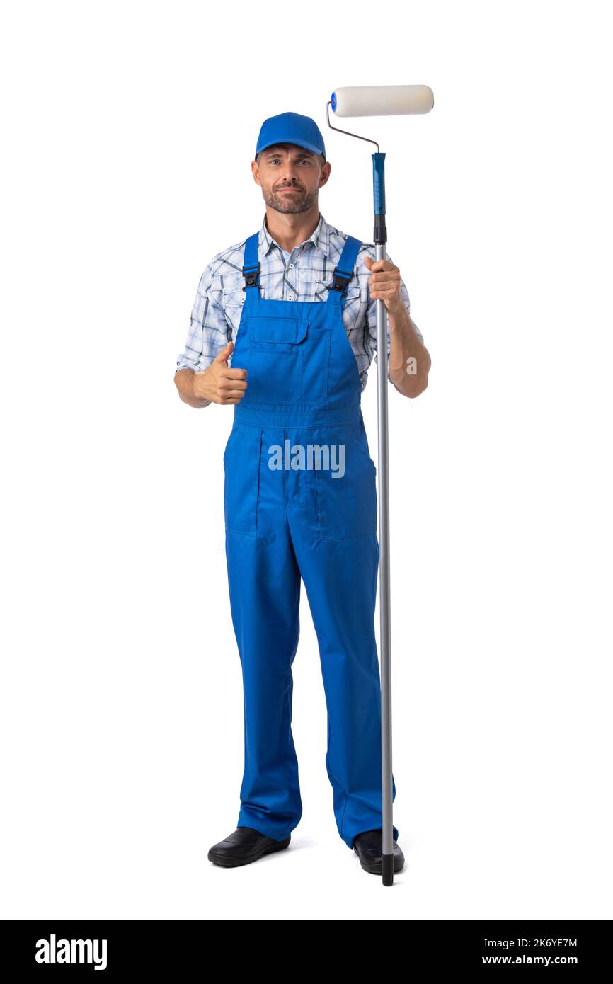 Mid adult professional house painter man in uniform with paint roller ...