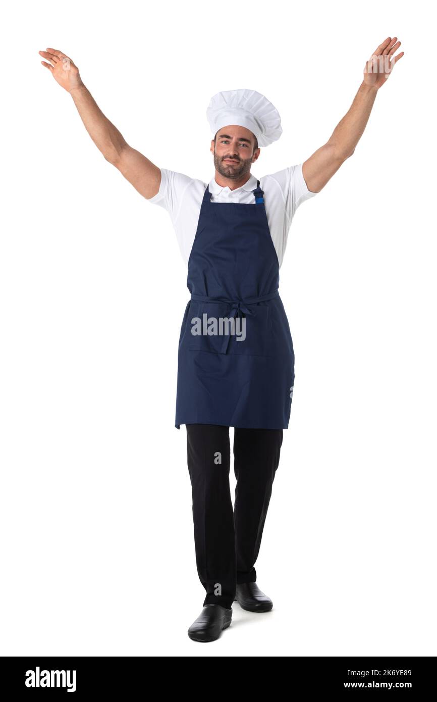 Portrait of happy young cook in uniform standing isolated over white ...