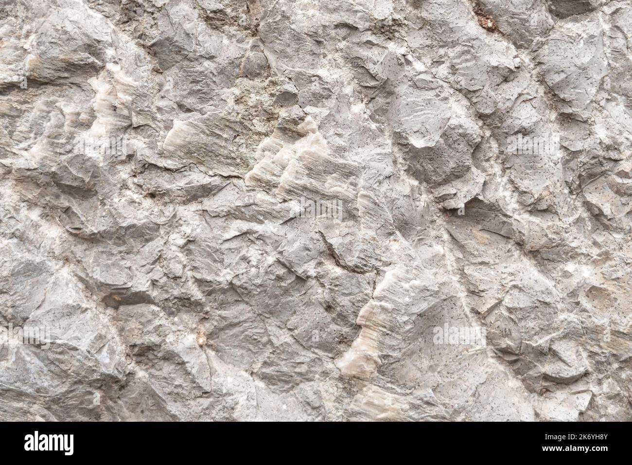 Rough gray rock wall with jagged grey stone boulder texture Stock Photo ...