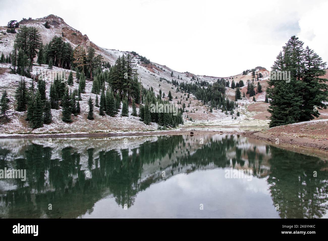 Volcanic lake in the snowy mountains. Ridge lakes in Lassen Volcanic ...