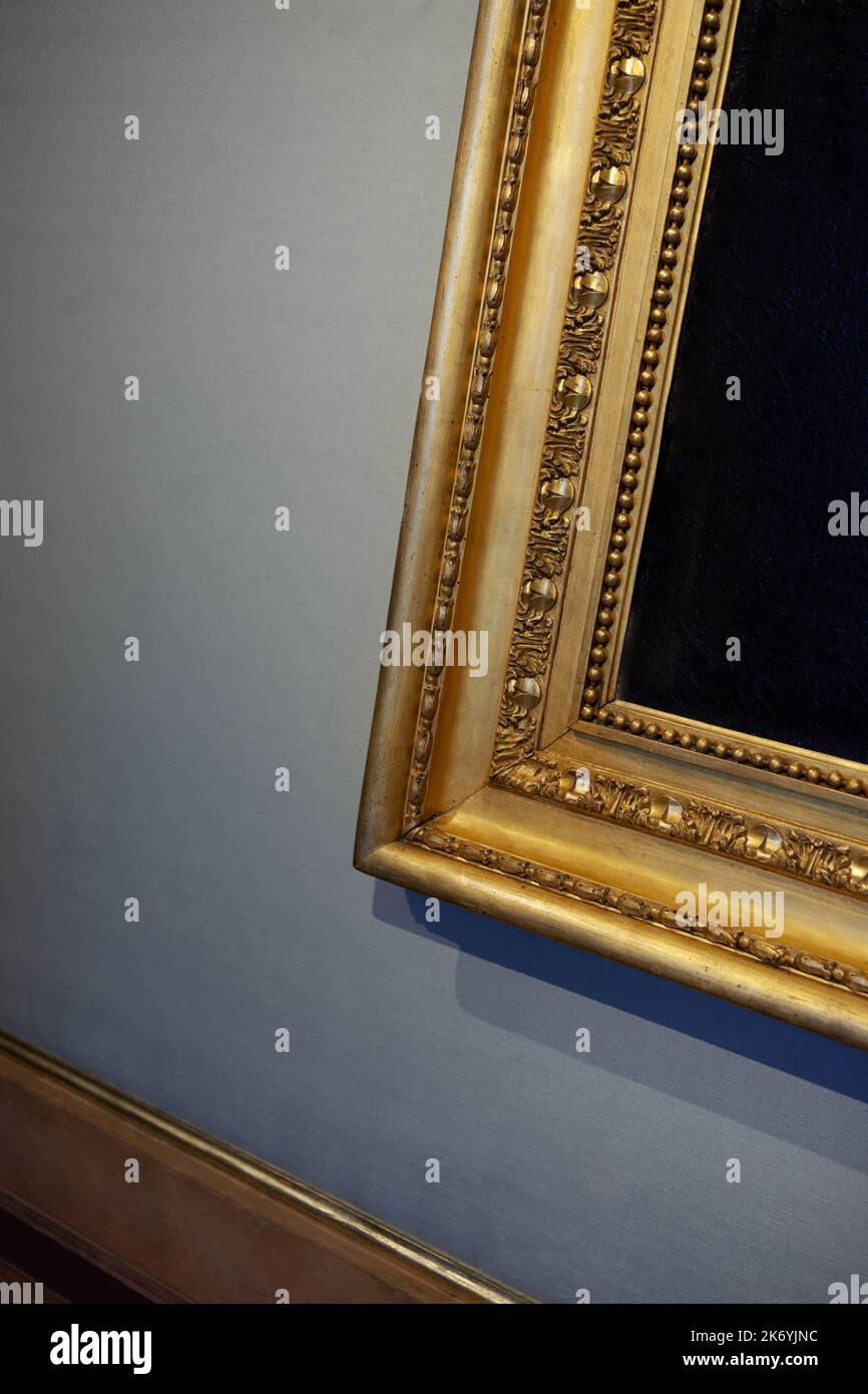 Golden frame in an art gallery Stock Photo - Alamy
