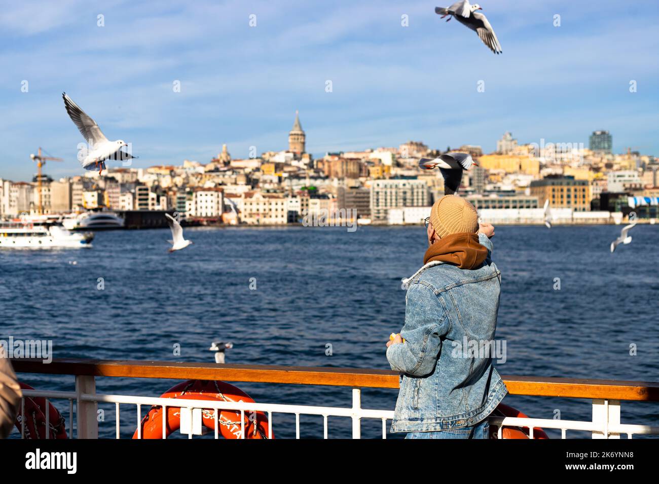 istanbul , Turkey Nowember 12 2021 : young tourists giving food to ...