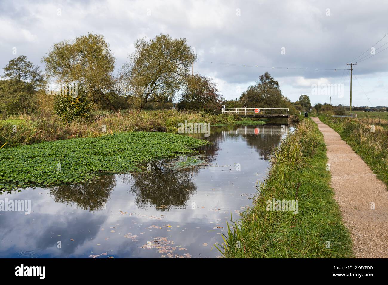 A footbridge spans the Rufford branch of the Leeds Liverpool canal at ...