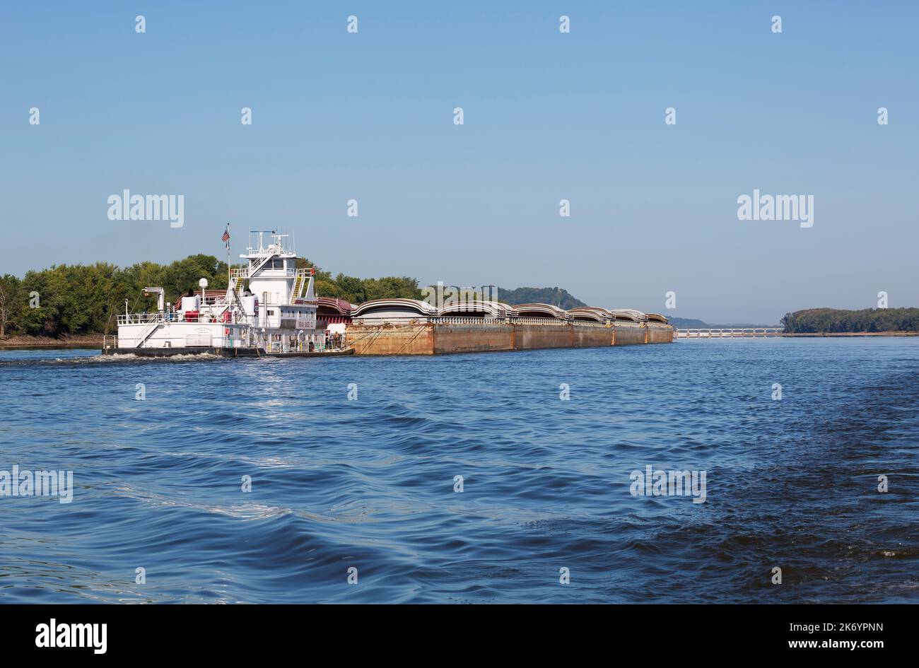 Tow with empty barges on the Upper Mississippi River in early autumn ...