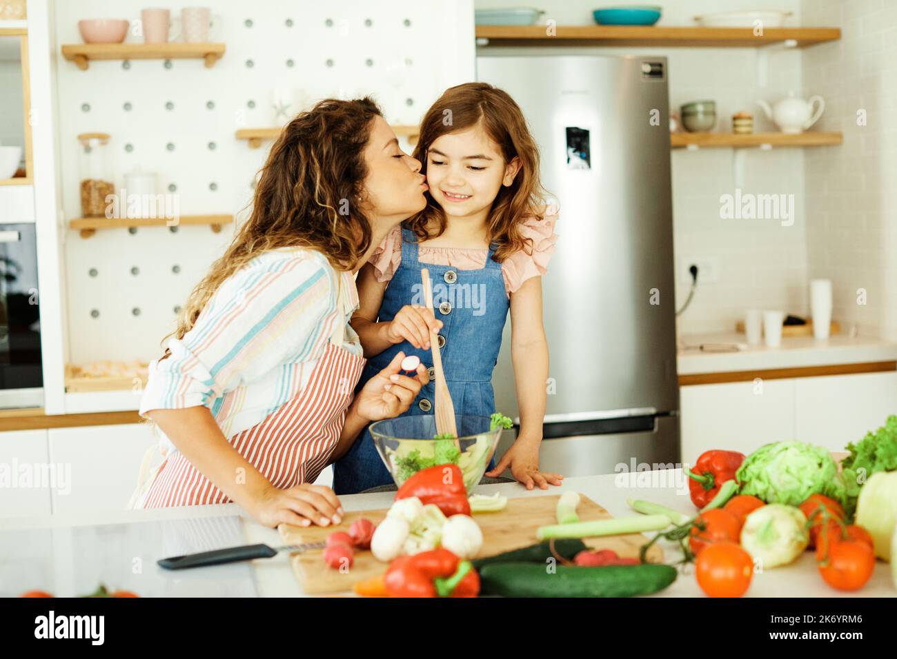 daughter mother kitchen food preparing cooking child bonding happy girl ...