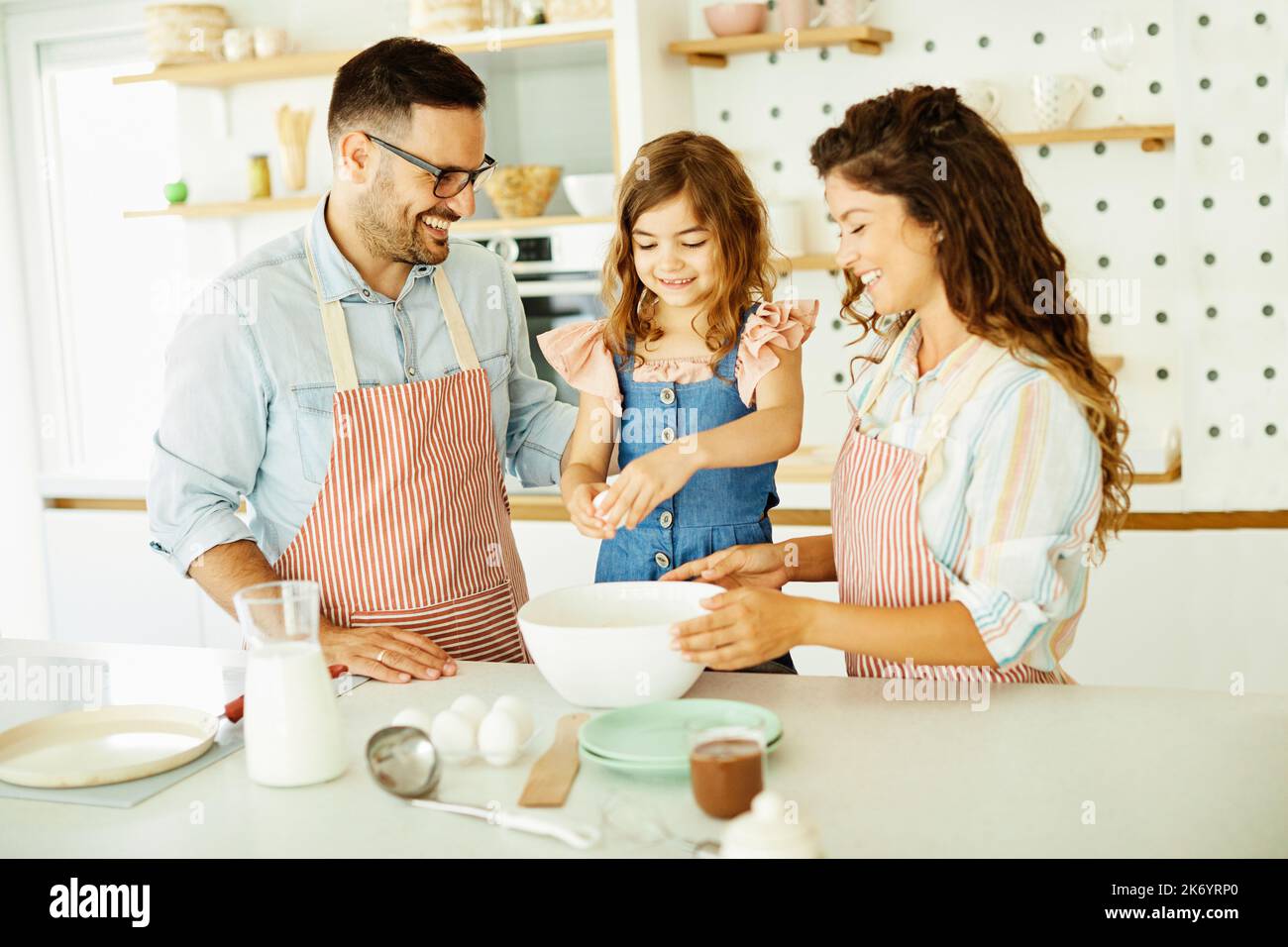 family child kitchen food daughter mother father cooking preparing ...