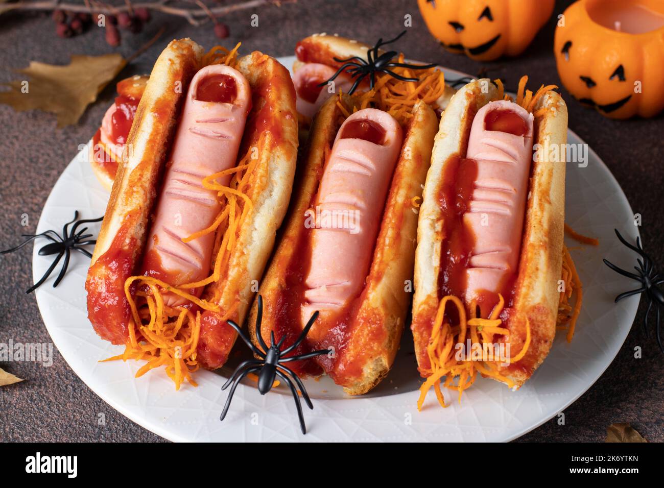 Themed food for Halloween - hot dog with bloody sausage fingers in ...