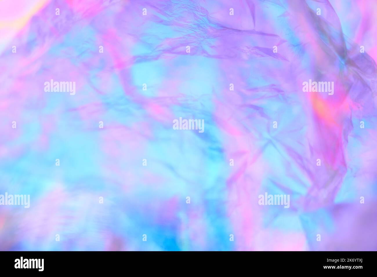 Holographic colorful plastic film in blue tones. Transparent ...