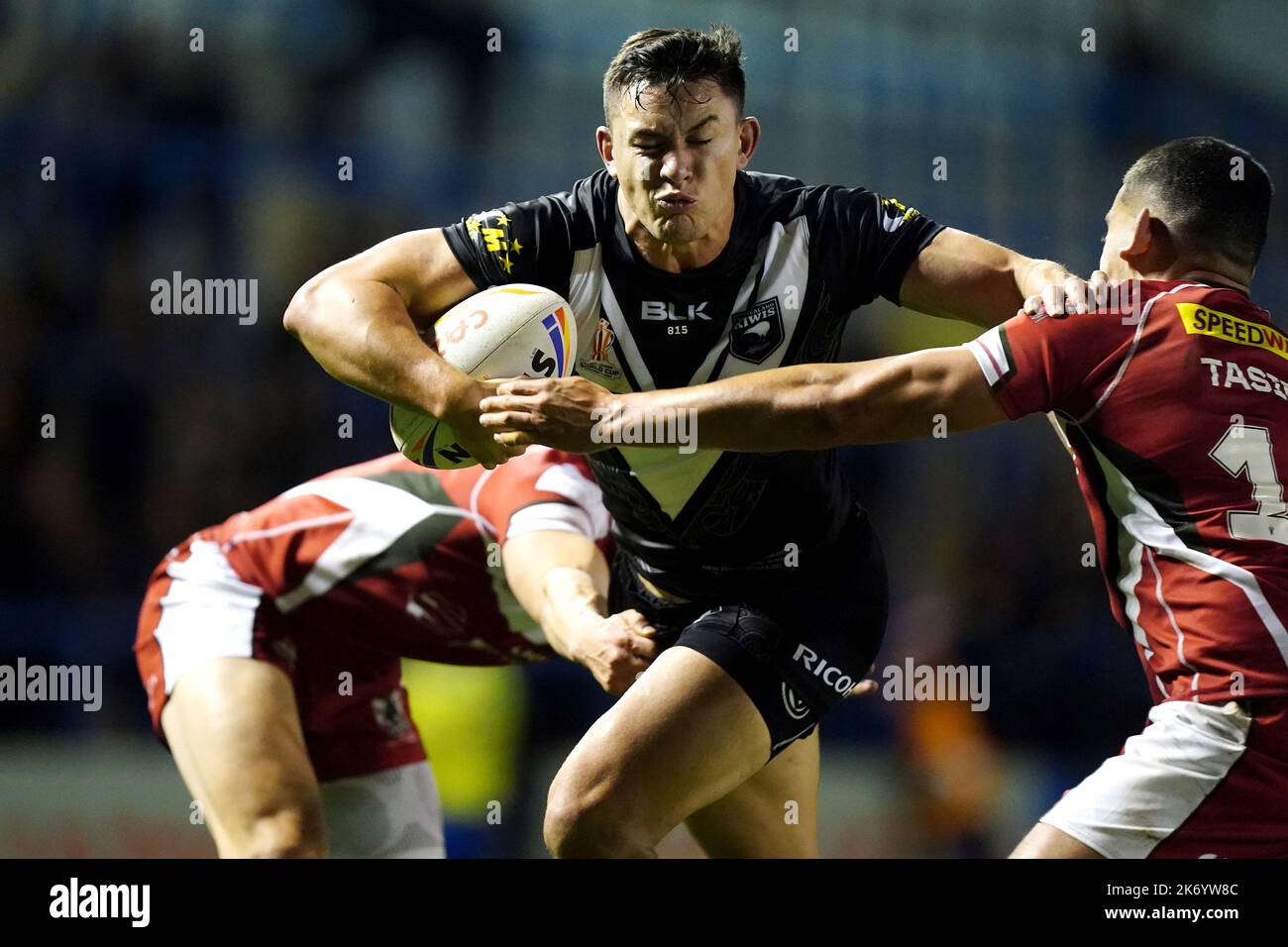 New Zealand's Joseph Manu (centre) is tackled by Lebanon's Charbel ...