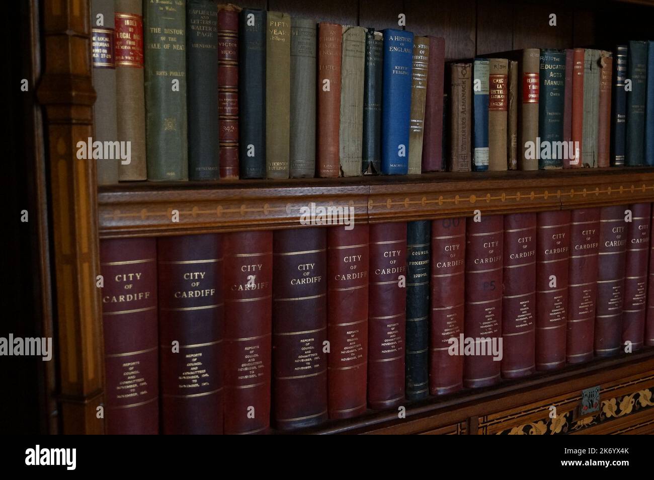 Cardiff, Wales (UK): interior of Cardiff Castle, books on a bookshelf ...