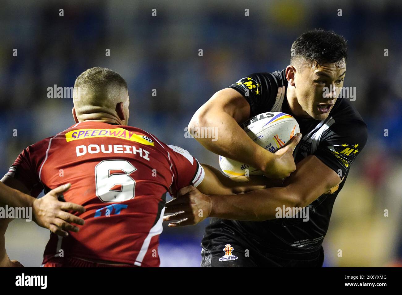 New Zealand's Joseph Manu (right) is tackled by Lebanon's Adam Doueihi ...
