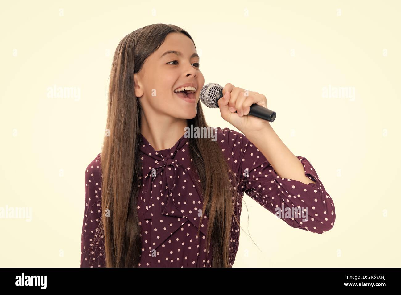 Teenager singing with a microphone. Karaoke singer. Teen girl sings ...