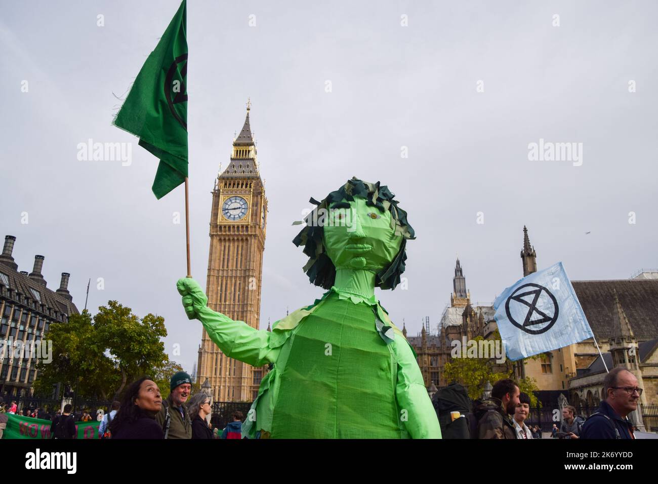 London, England, UK. 16th Oct, 2022. A protester wears a green giant ...