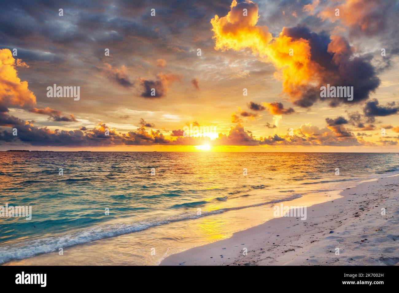 Vibrant sunset over ocean on Maldives Stock Photo - Alamy