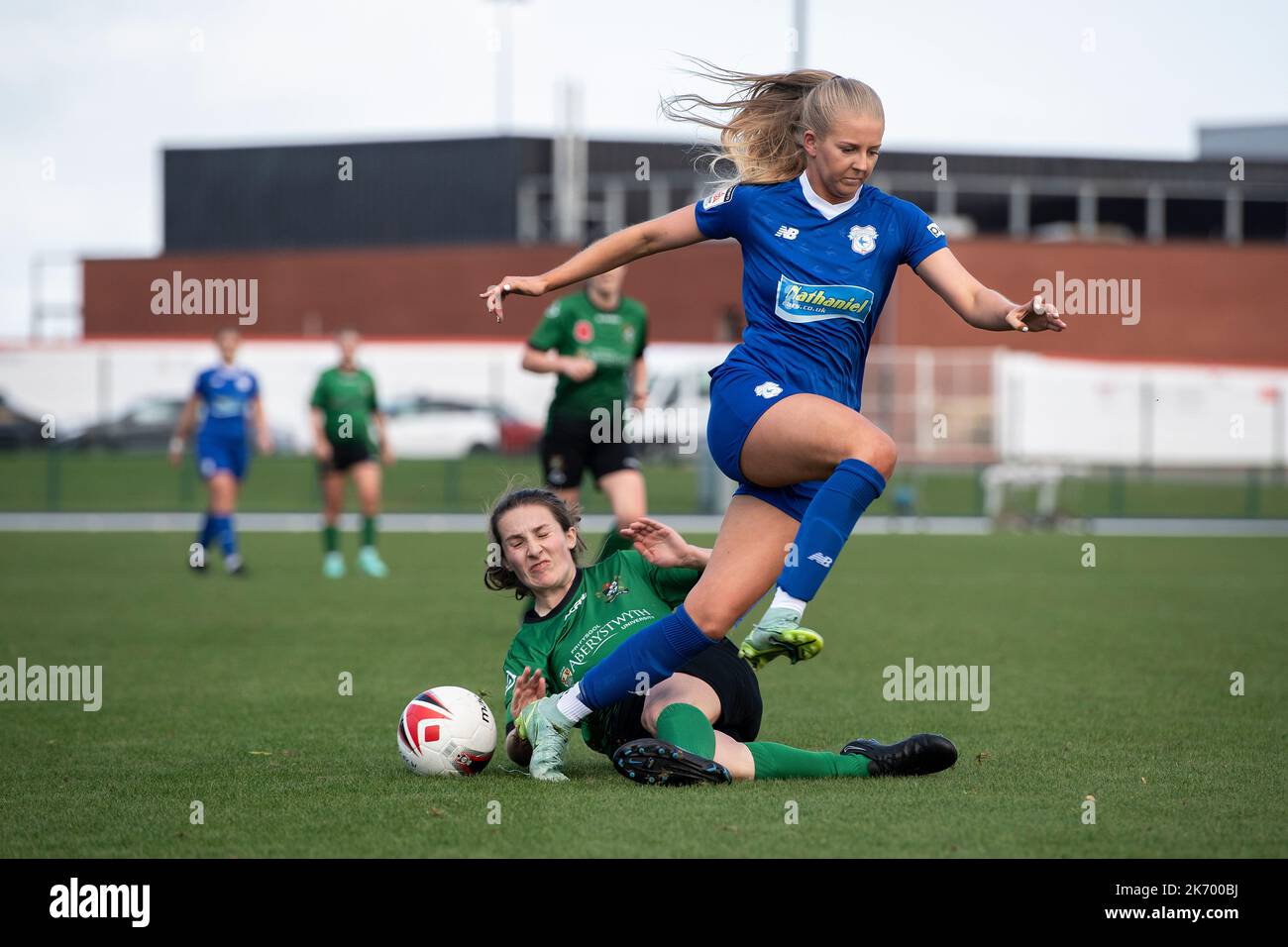 Rhianne Oakley of Cardiff City Women FC is tackled by Rebecca Mathias ...