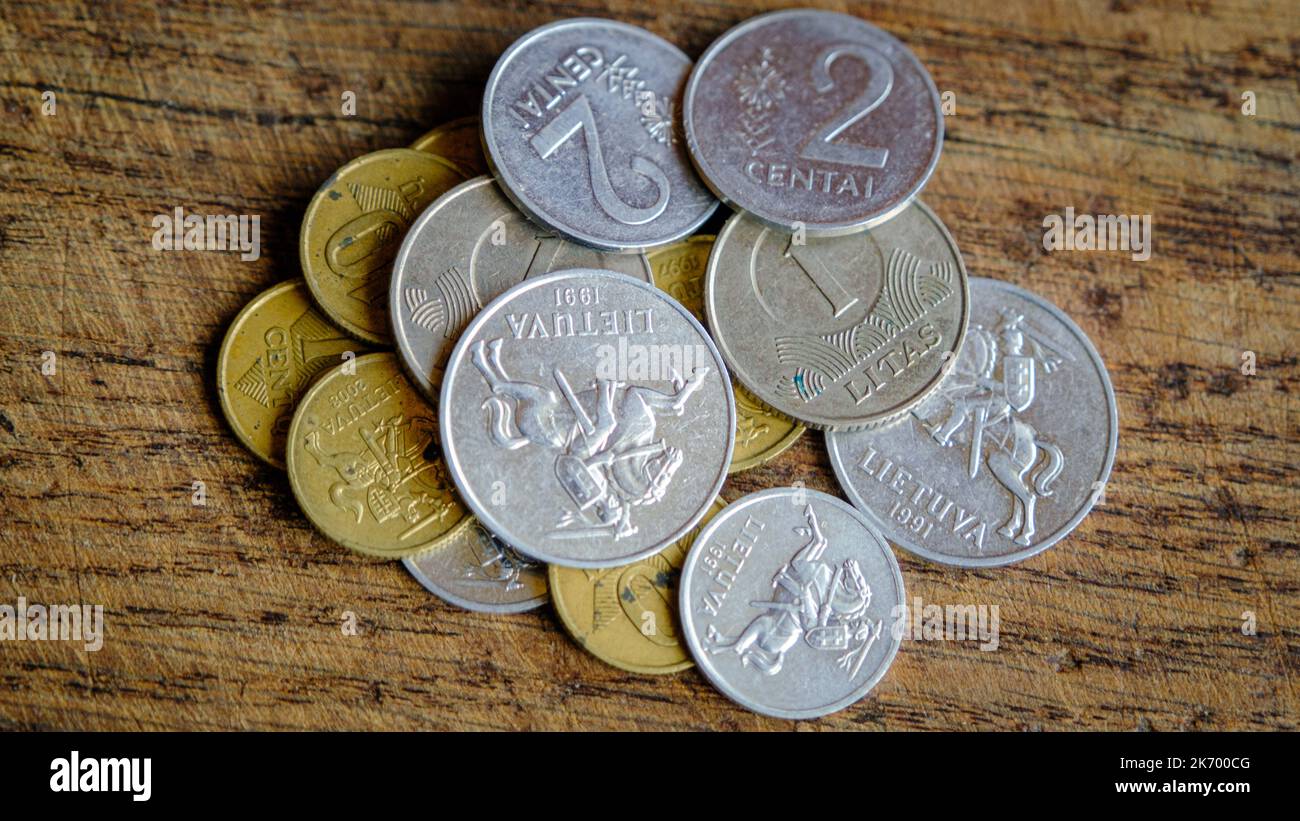 Various old Lithuanian coins isolated on wooden background Stock Photo ...
