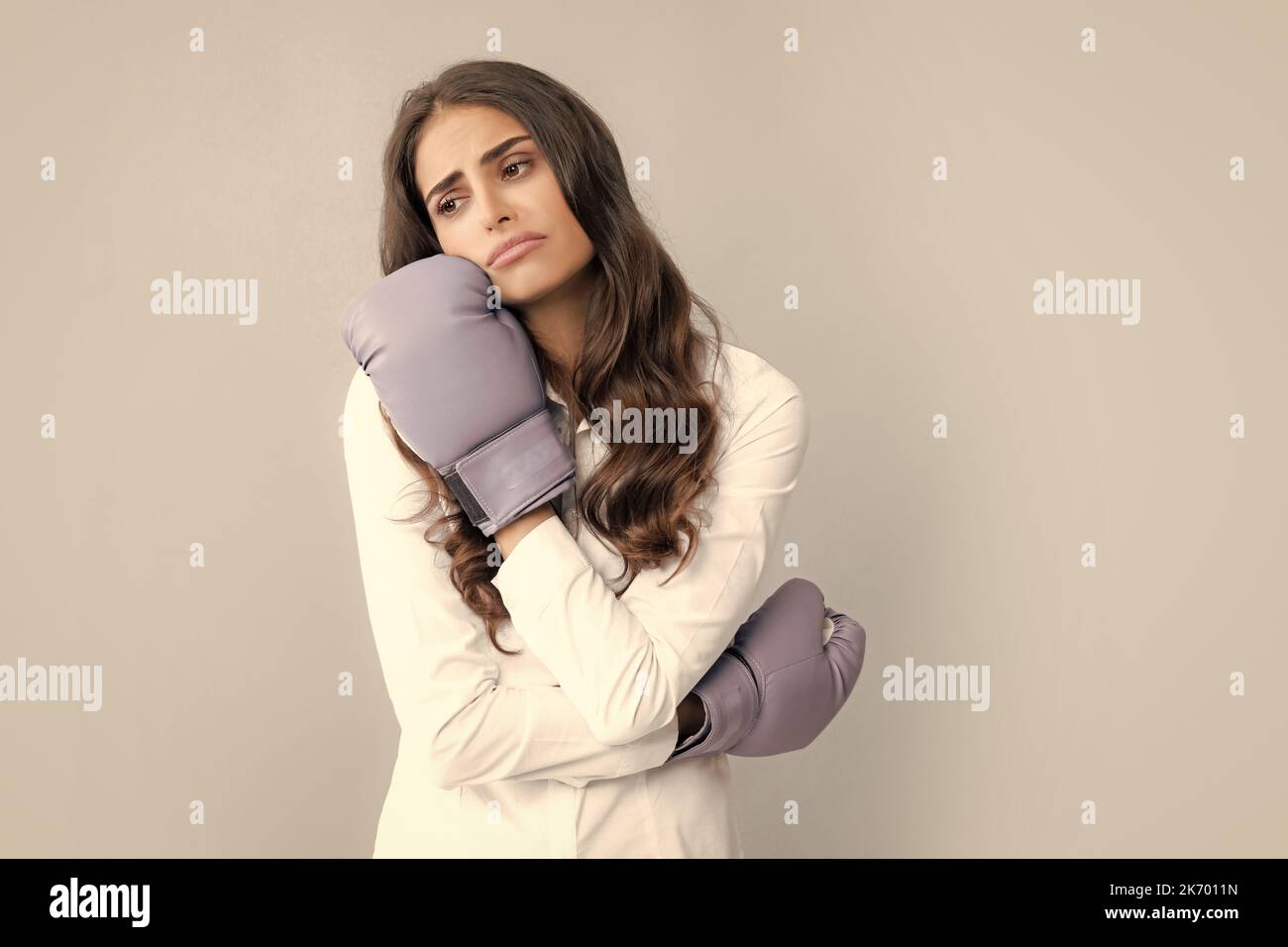 Sad tired woman in boxing gloves. Girl boxer posing with gloves Stock ...
