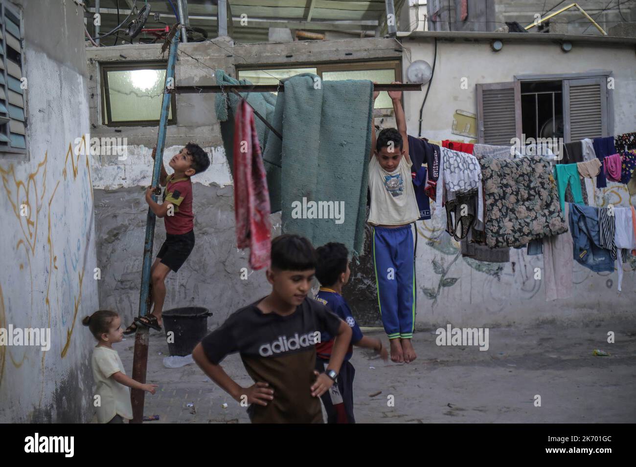 Palestinian refugee children play outside their house in the northern ...