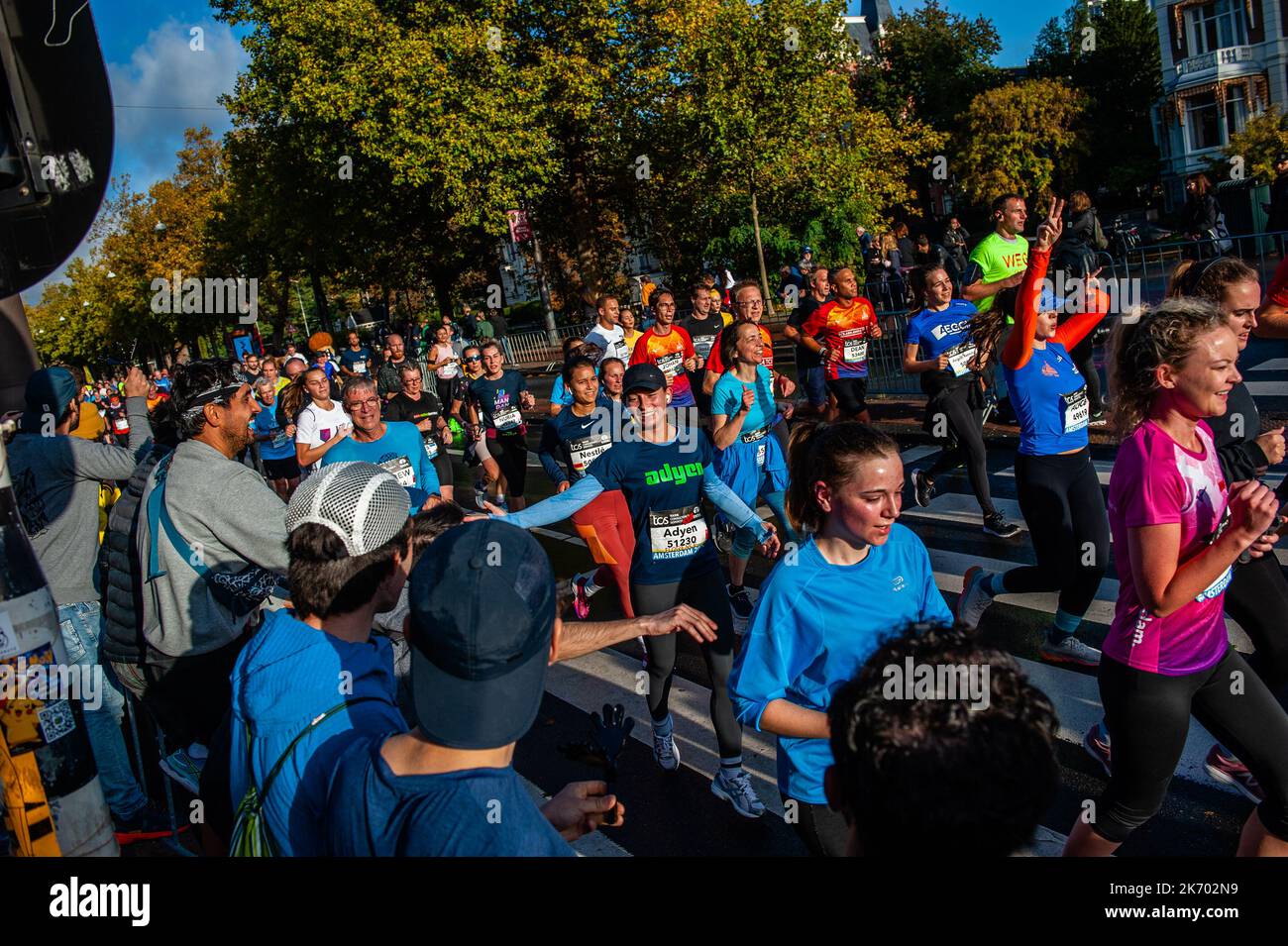 People in the audience are seen cheering the participants. More than ...