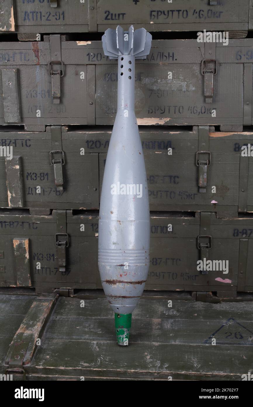 Soviet or russian 120 mm mortar shell on army green crate. Text in ...