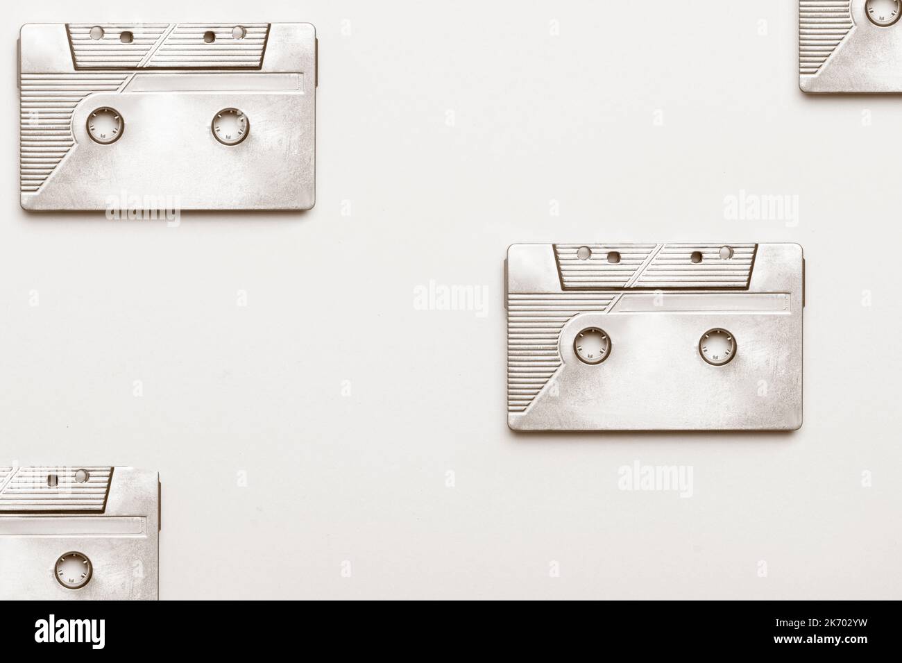 Silver fancy retro old audio cassettes tape on beige color background ...