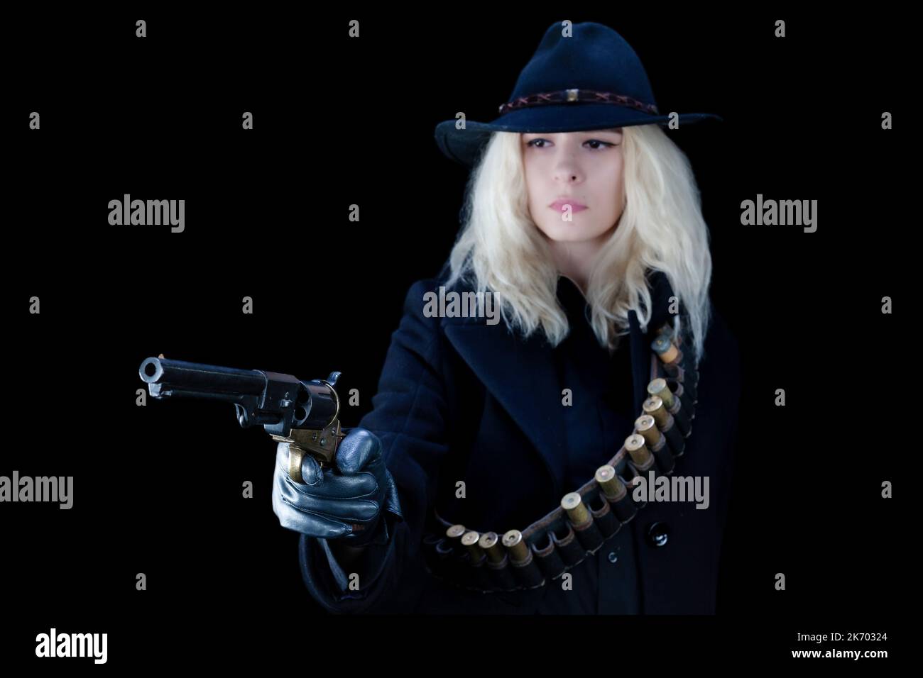 Old west blonde girl wearing black hat with revolver handgun on black ...