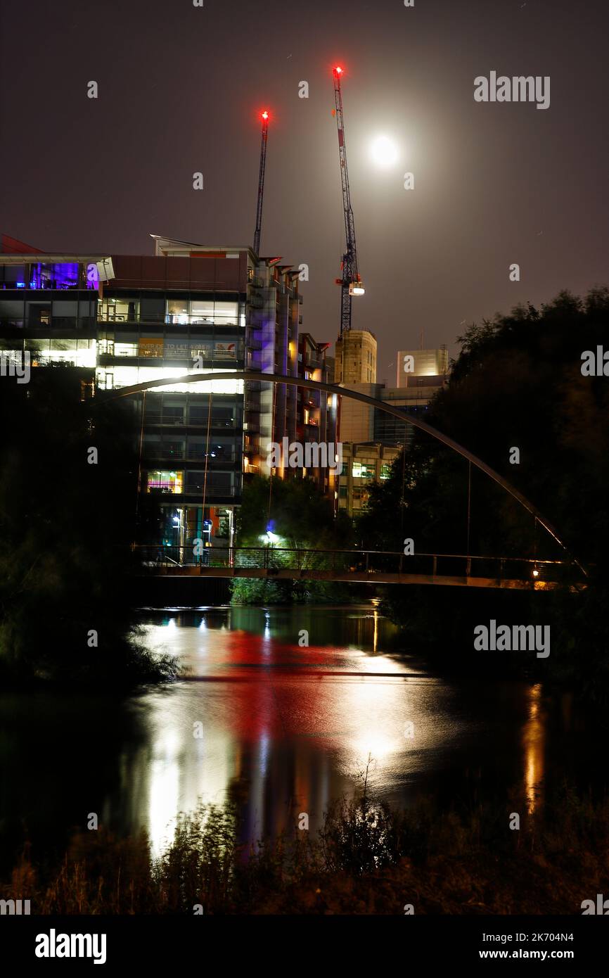 The Moon shining bright over Whitehall Footbridge and the River Aire in ...
