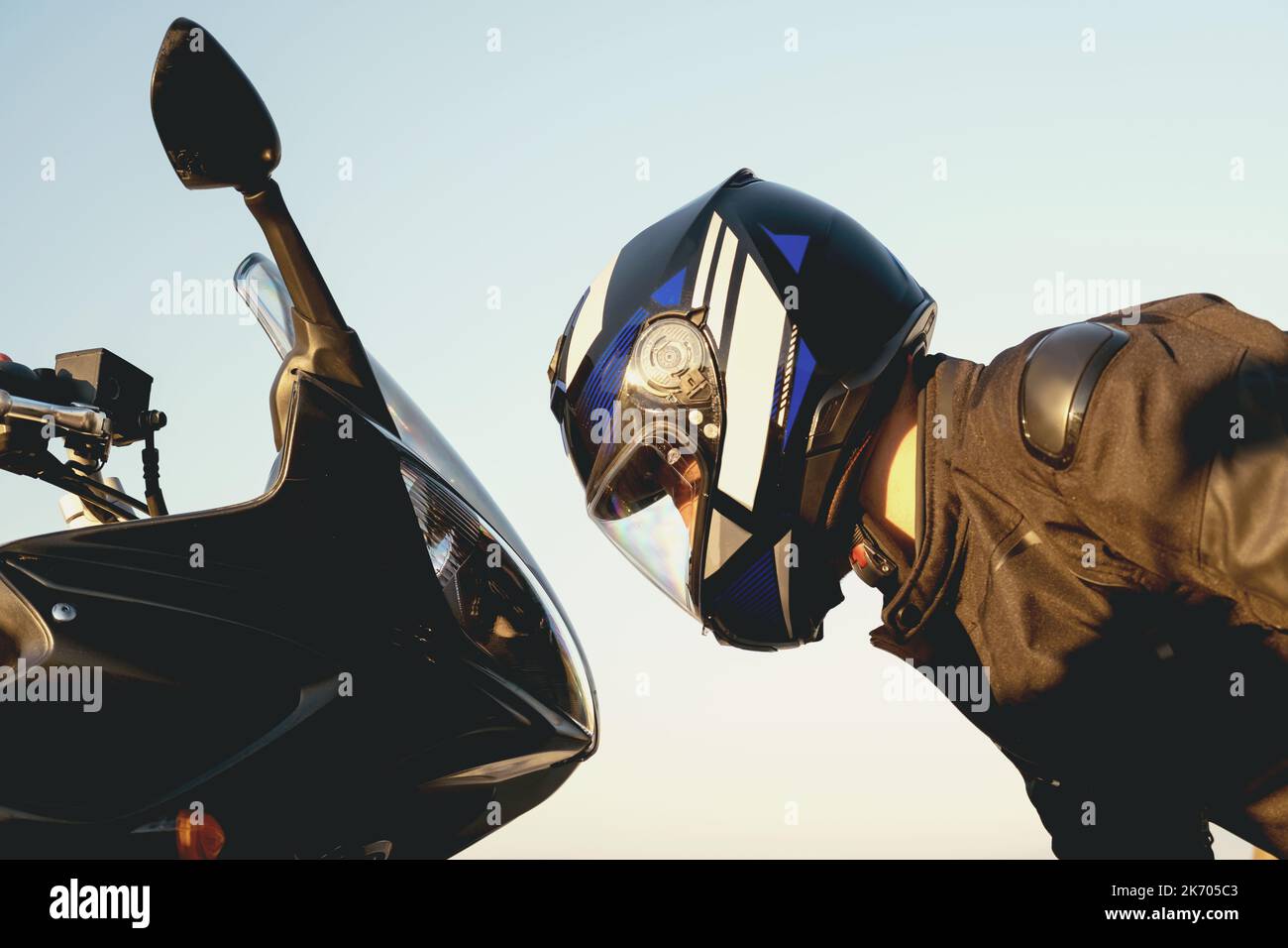 Rider poses with his supersport motorcycle head to head pose Stock ...