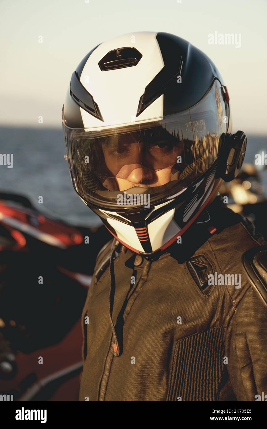 Portrait of a motorcycle rider with helmet Stock Photo - Alamy