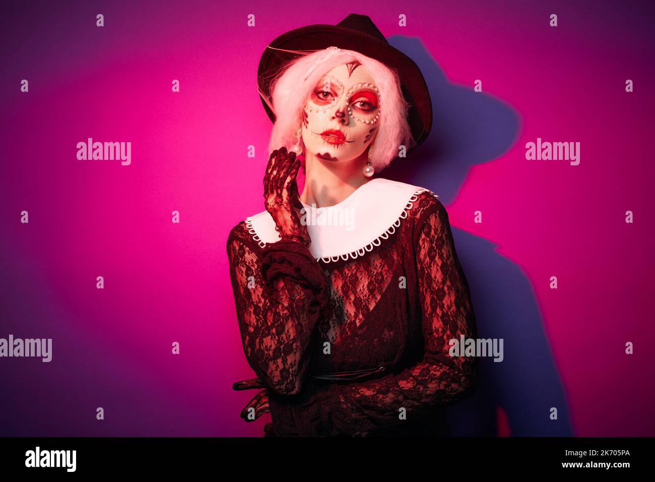 Witch in Halloween costume with grey hair Stock Photo - Alamy