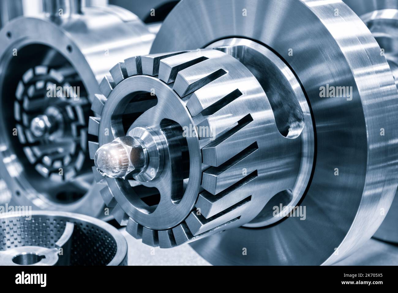 Industrial metalworking concept background, shiny metal shaft close up ...