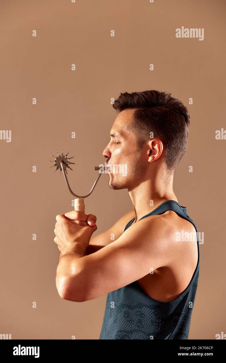 Young man testing breathing function by breath a cizer. Take care about ...