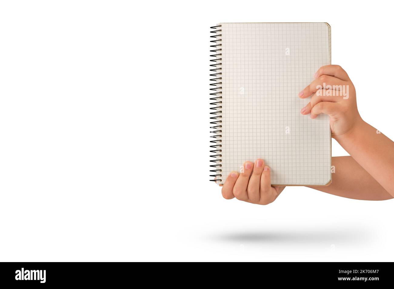 Empty notepad in hand. A hand holds a blank notepad with copy space ...
