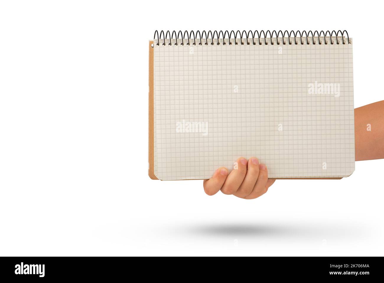 Empty notepad in hand. A hand holds a blank notepad with copy space ...