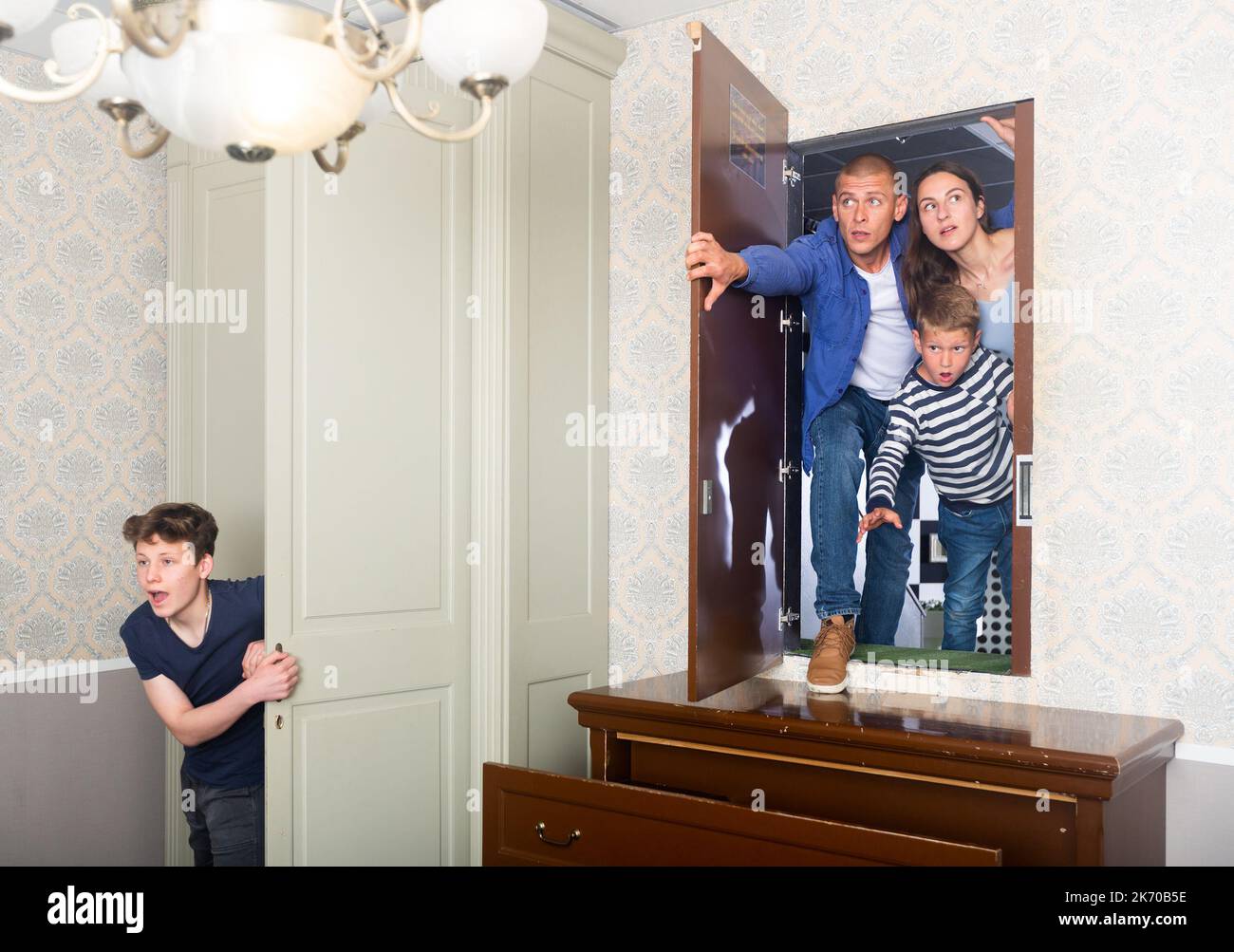 Family is looking for a way out of the quest room, going through ...