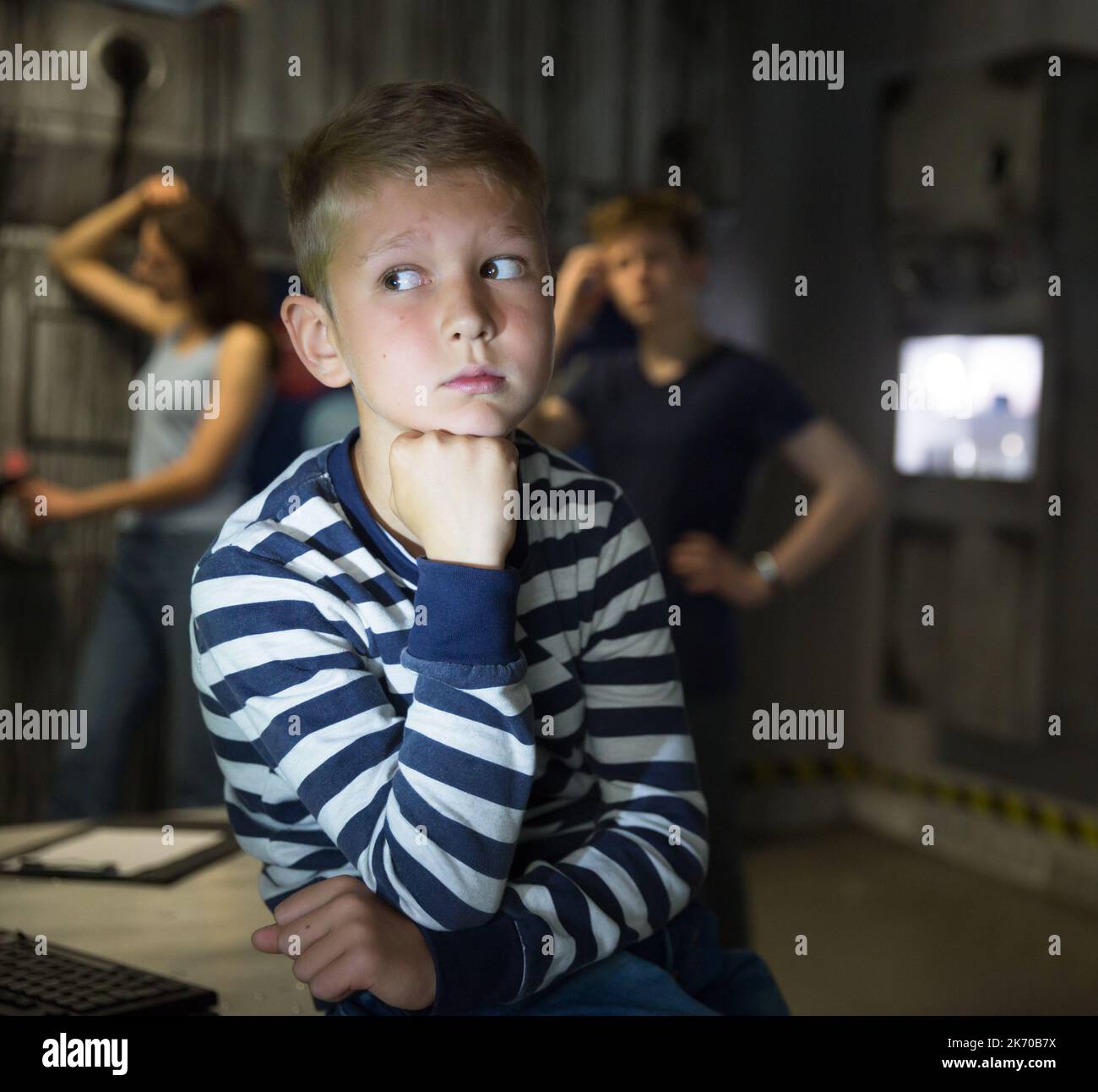 Interested tween boy solving conundrums in escape room Stock Photo - Alamy