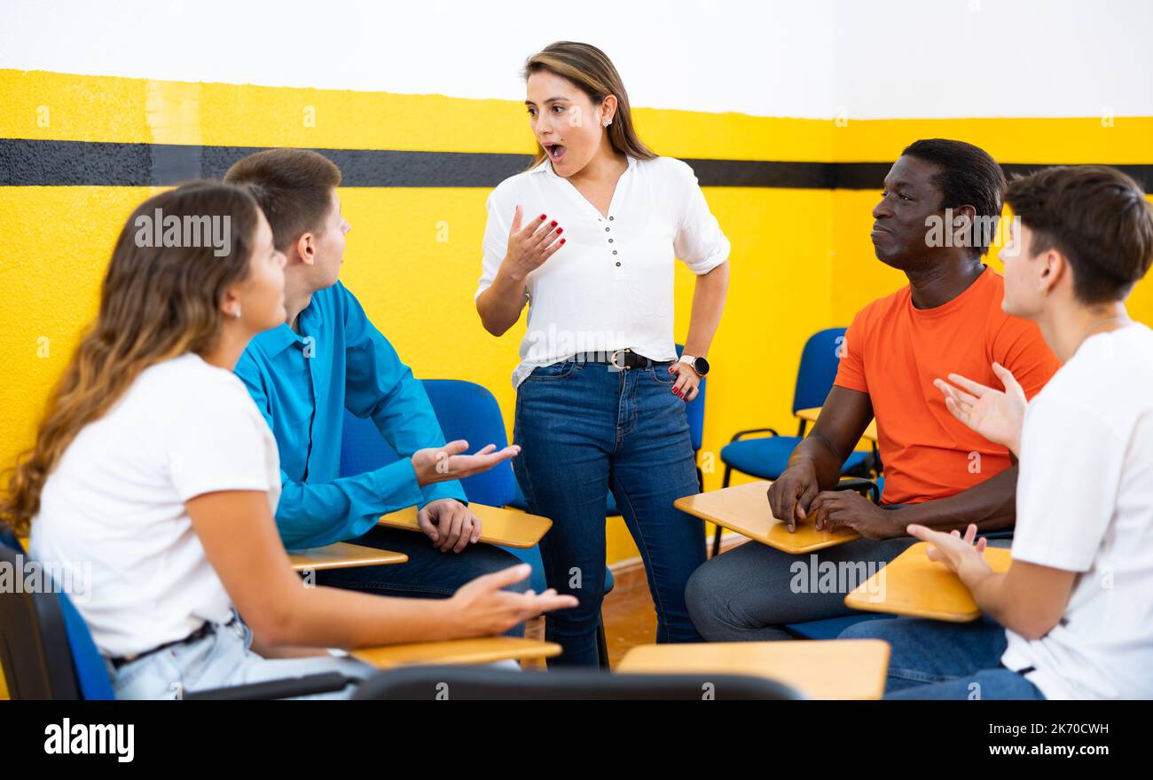 Woman training oral skills in speaking club Stock Photo - Alamy