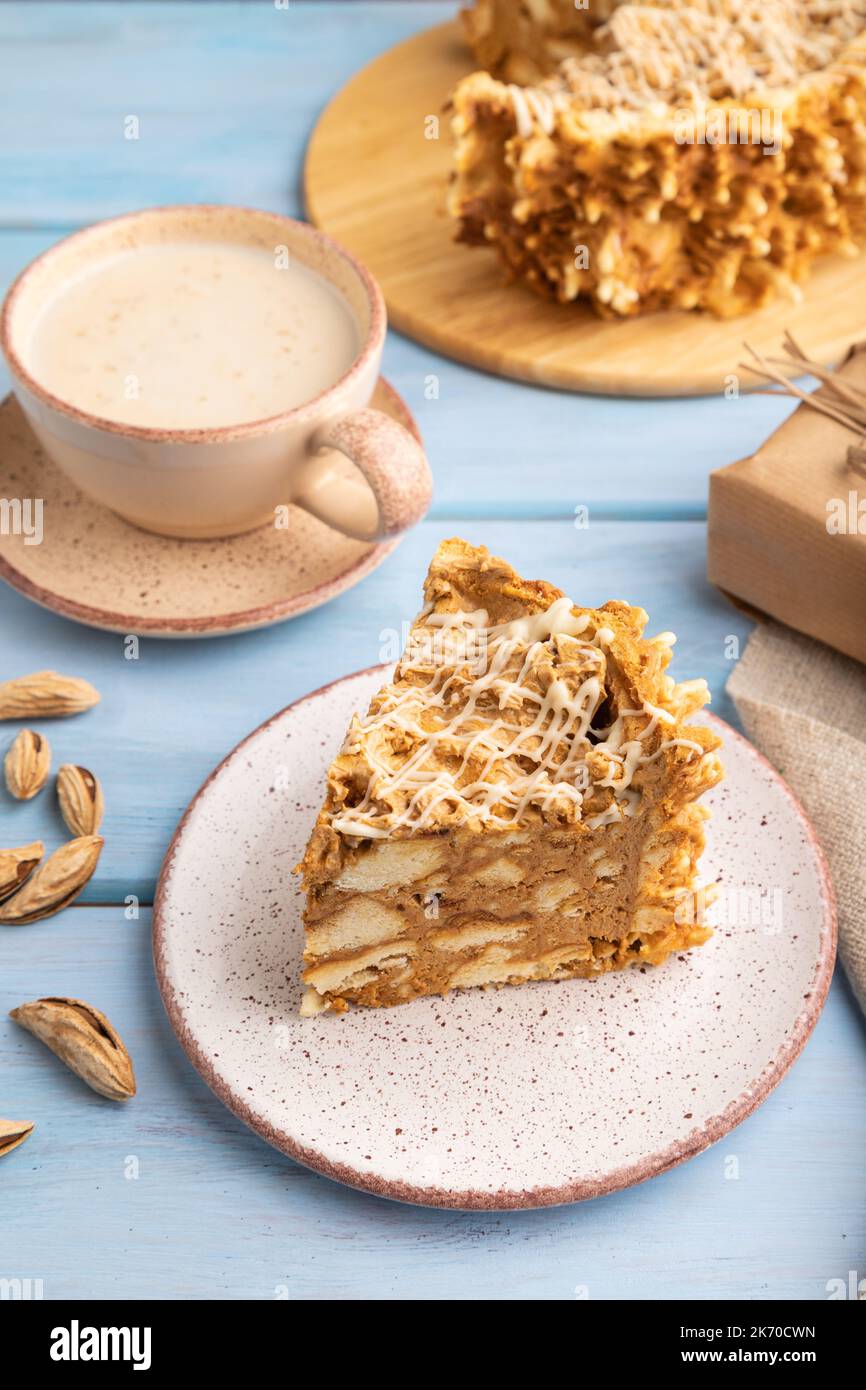 Traditional lithuanian cake shakotis with cup of coffee on blue wooden ...